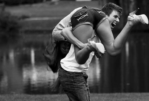 Guy Carrying Girlfriend Over Shoulder
