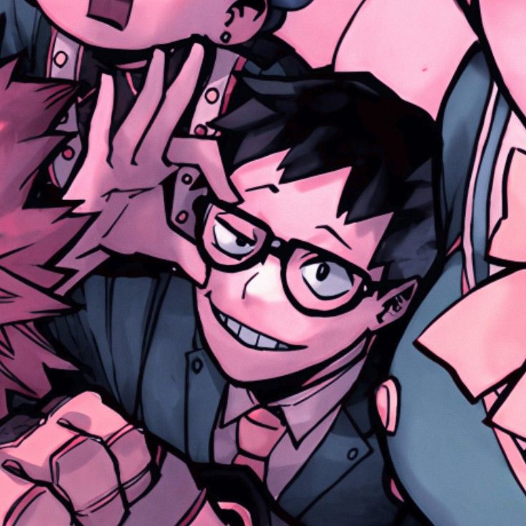 A Man With Glasses Is Surrounded By Other People In Pink And Black Outfits One Holding His Hand