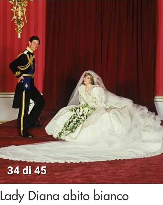 the bride and groom are posing in their wedding gowns the bride and groom are posing in their wedding gowns