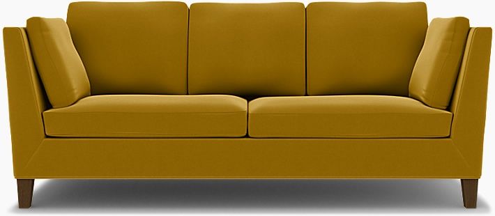 A Yellow Couch Sitting On Top Of A White Floor