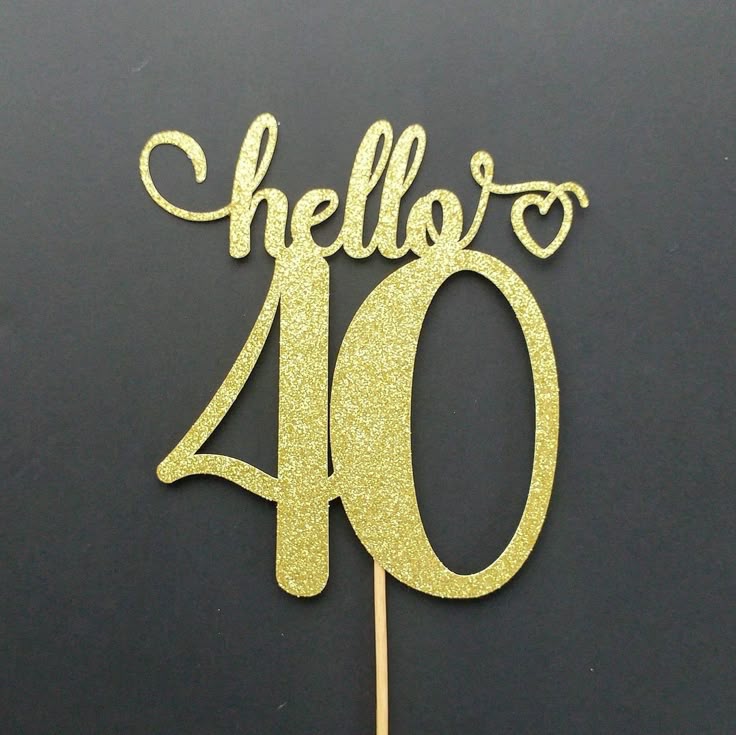 A Cake Topper That Says Hello 40 On It