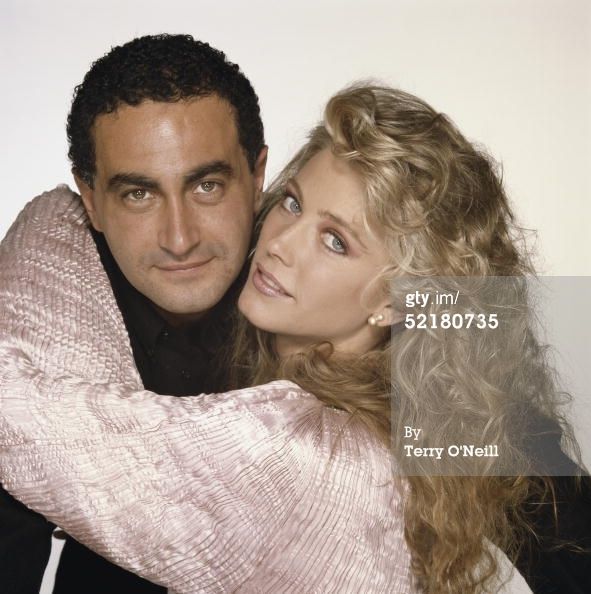 a man and woman hugging each other in front of a white background a man and woman hugging each other in front of a white background