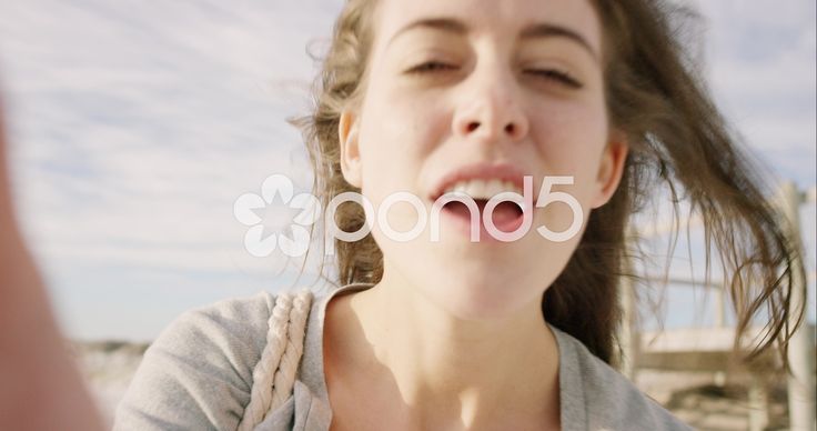 Beautiful Woman Taking Selfie Using Phone On Beach At Sunset Smiling And Stock Footageselfie