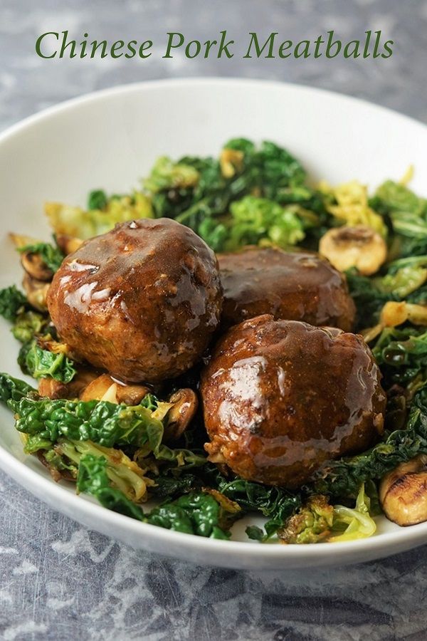 Chinese Pork Meatballs With Broccoli And Mushrooms In A White Bowl On A