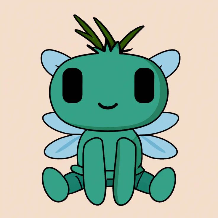 a green toy with black eyes sitting on top of a pink background and ... a green toy with black eyes sitting on top of a pink background and ...