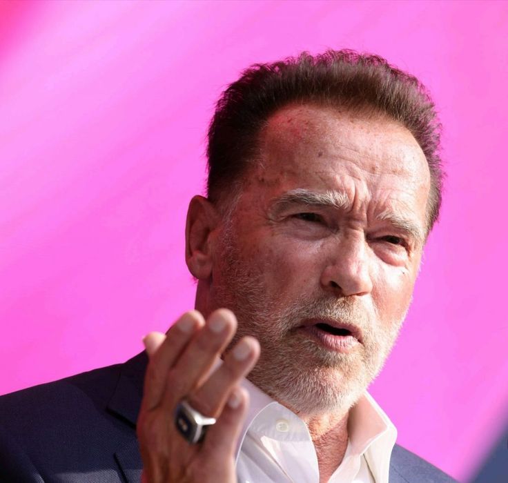 a close up of a person wearing a suit and holding his hands in front of him a close up of a person wearing a suit and holding his hands in front of him