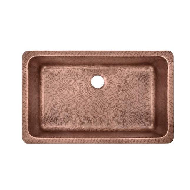 A Copper Sink On A White Background