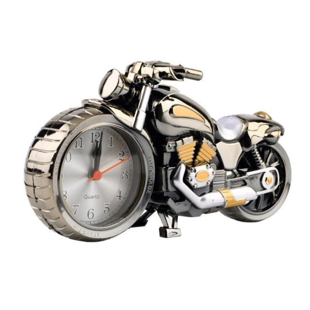 A unique piece of an alarm clock in the shape of a motorcycle. The ... A unique piece of an alarm clock in the shape of a motorcycle. The ...