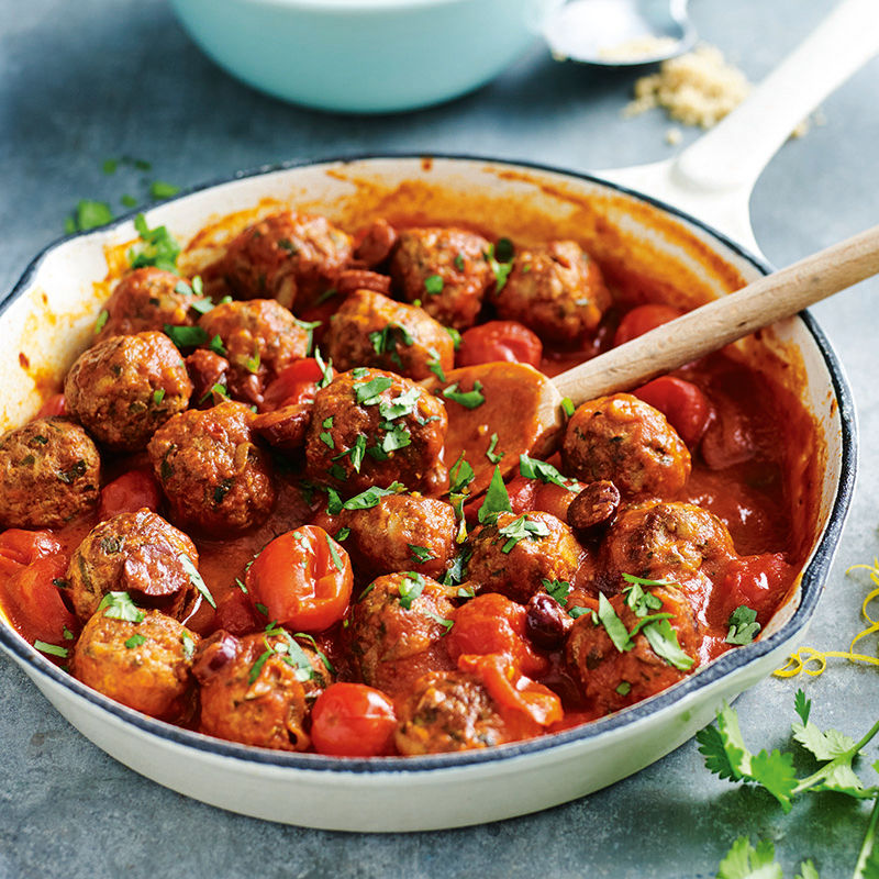 Meatballs And Tomatoes In A Tomato Sauce With Parsley
