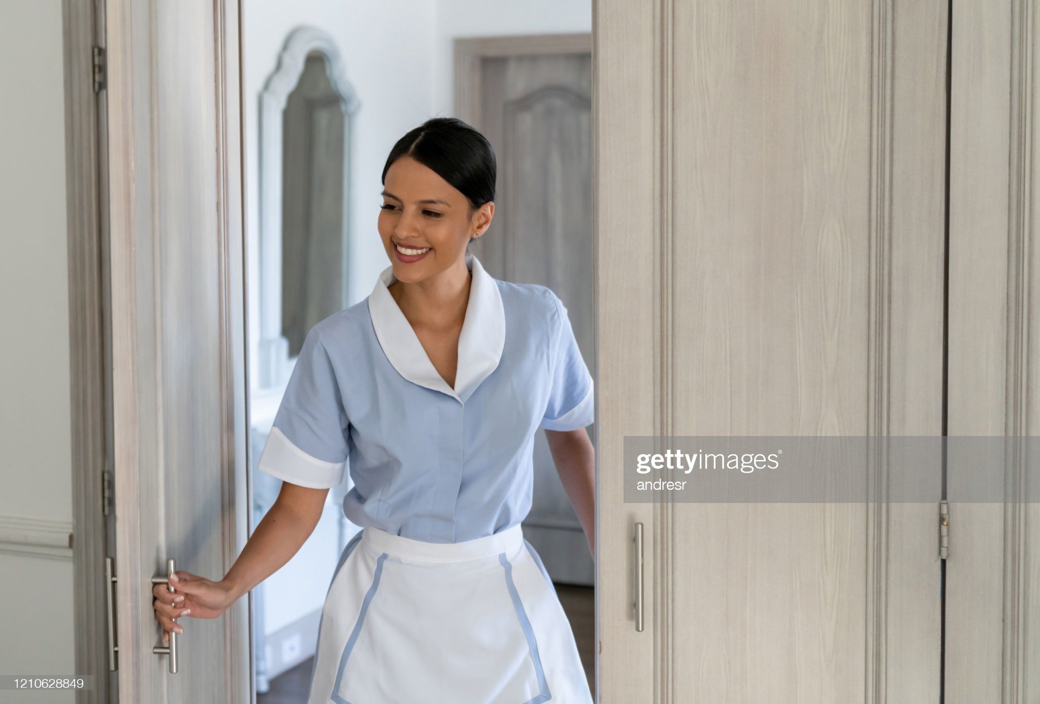 Happy Latin American Maid Working At A Hotel And Entering A Room To Maid Outfit Maid Outfits