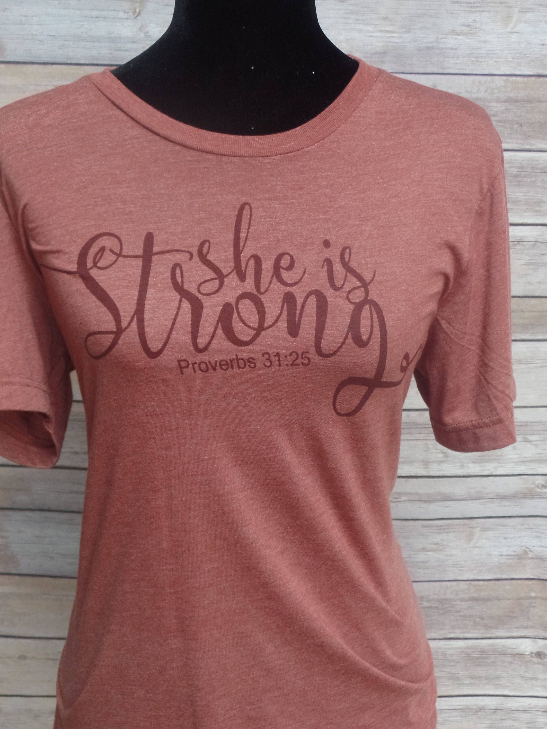 She Is Strong Proverbs 31 25 Christian Graphic Tee Womens Graphic