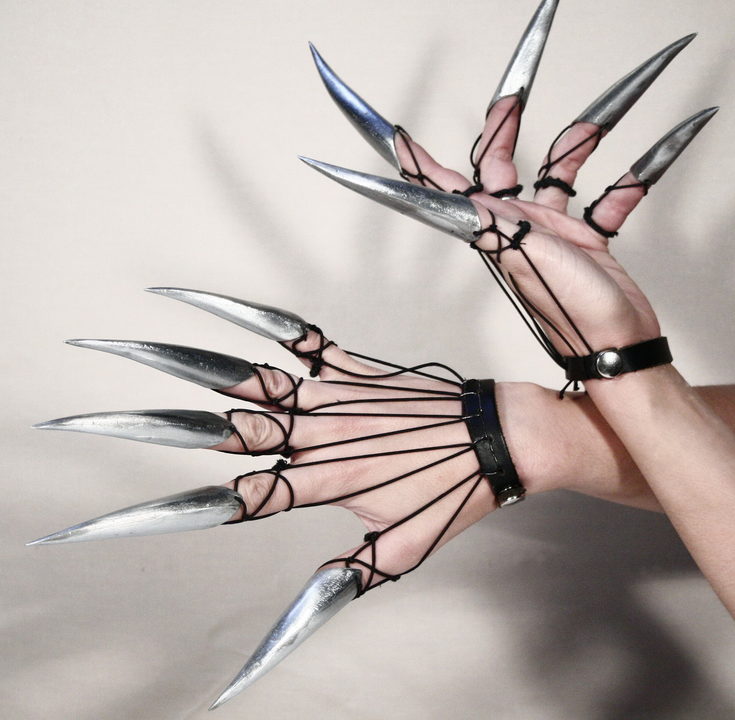 Embers Claws Slide On Over Her Fingers On Either Hand And Are Secured By A Webwork Of Ties That