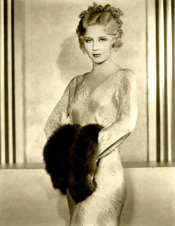 An Old Photo Of A Woman Holding A Fur Purse