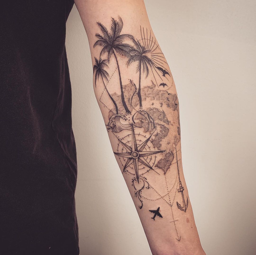 a man's arm with a compass and palm trees on the beach tattoo design a man's arm with a compass and palm trees on the beach tattoo design