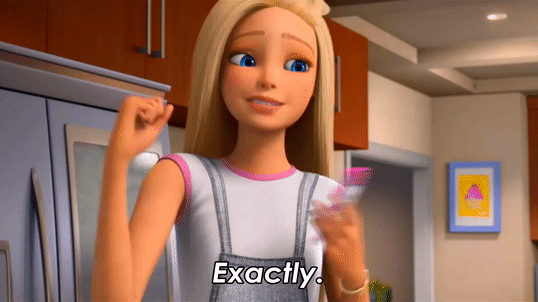 The Barbie Doll Is Holding A Toothbrush In Her Hand