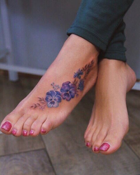 Blue And Purple Colored Flower Tattoo On The Foot Foot Tattoos Foot Tattoos